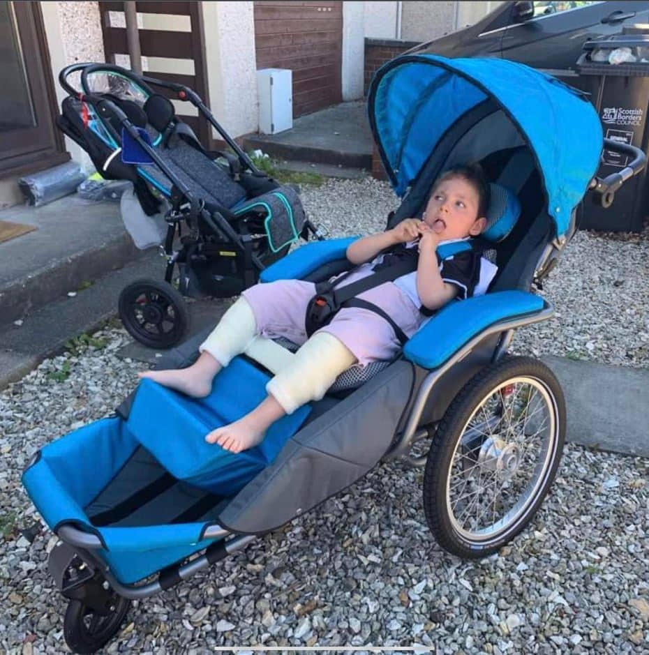 Tommy receiving his new JOSI Wismi Buggy - Fast Aid Medical and Mobility